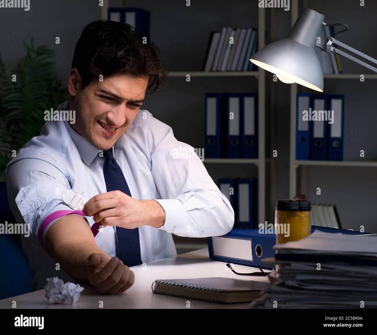 The employee relieving stress from overtime with drugs narcotics Stock ...