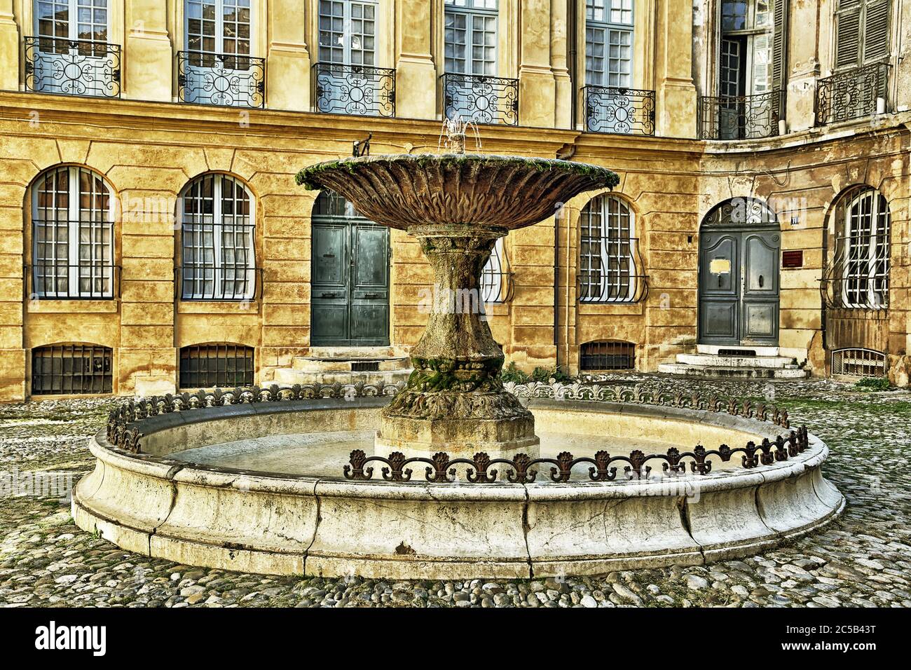 Old fountain on the 17th century Albertas square in Aix-en-Provence ...