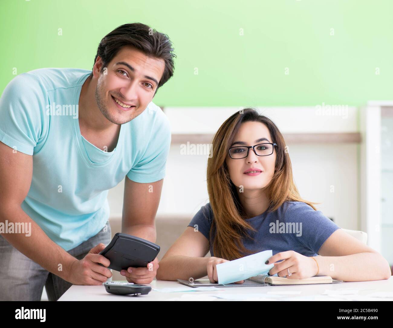 The young family struggling with personal finance Stock Photo - Alamy