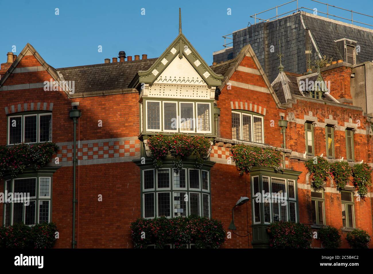 Typical house with red brick wall and geometric design elements. Dublin ...