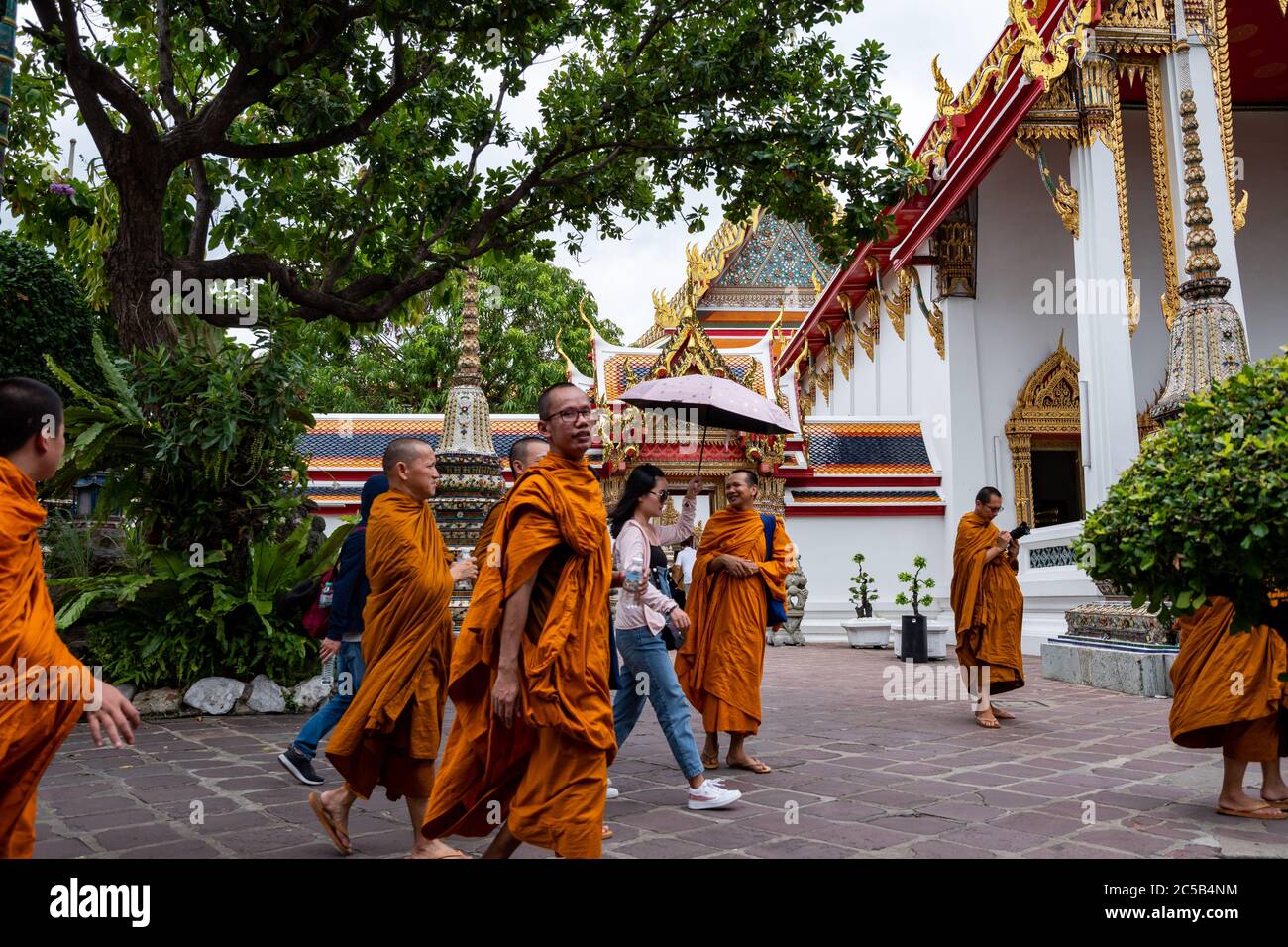 A group of Buddhist Monks visiting Wat Pho (also known as the Temple of the Reclining Buddha ...