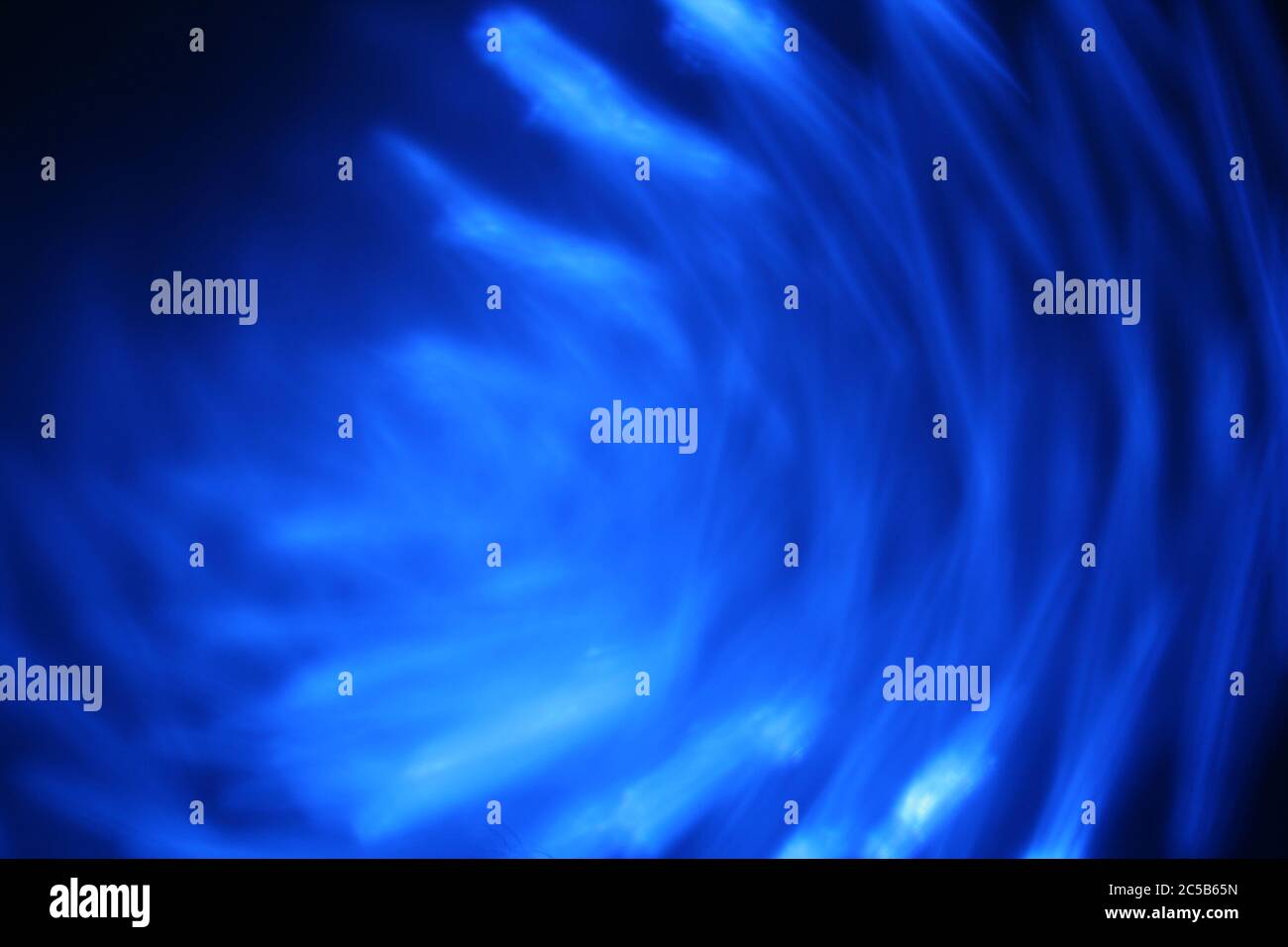 Abstract background with staggered and refracted vortex light effects ...