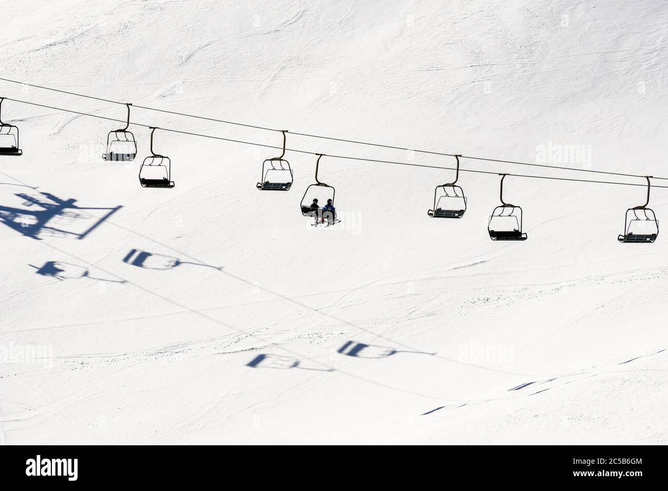 Beautiful landscape of snowy slope with a ropeway in South Tyrol ...