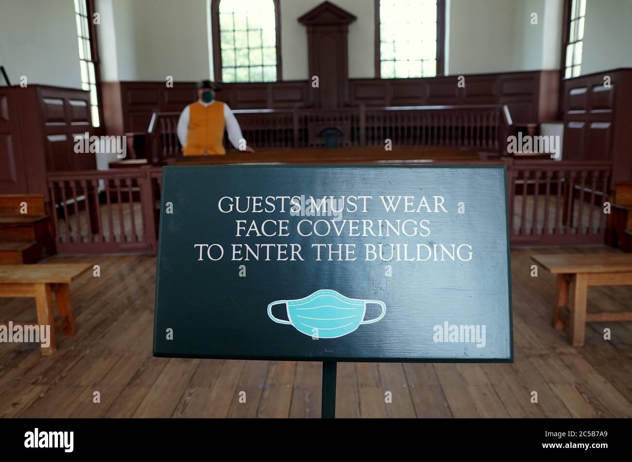 Williamsburg, Virginia, U.S.A - June 30, 2020 - The door sign asking ...