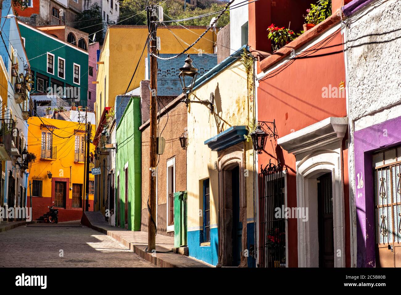 View of the colorful buildings a cobblestone street in the historic ...