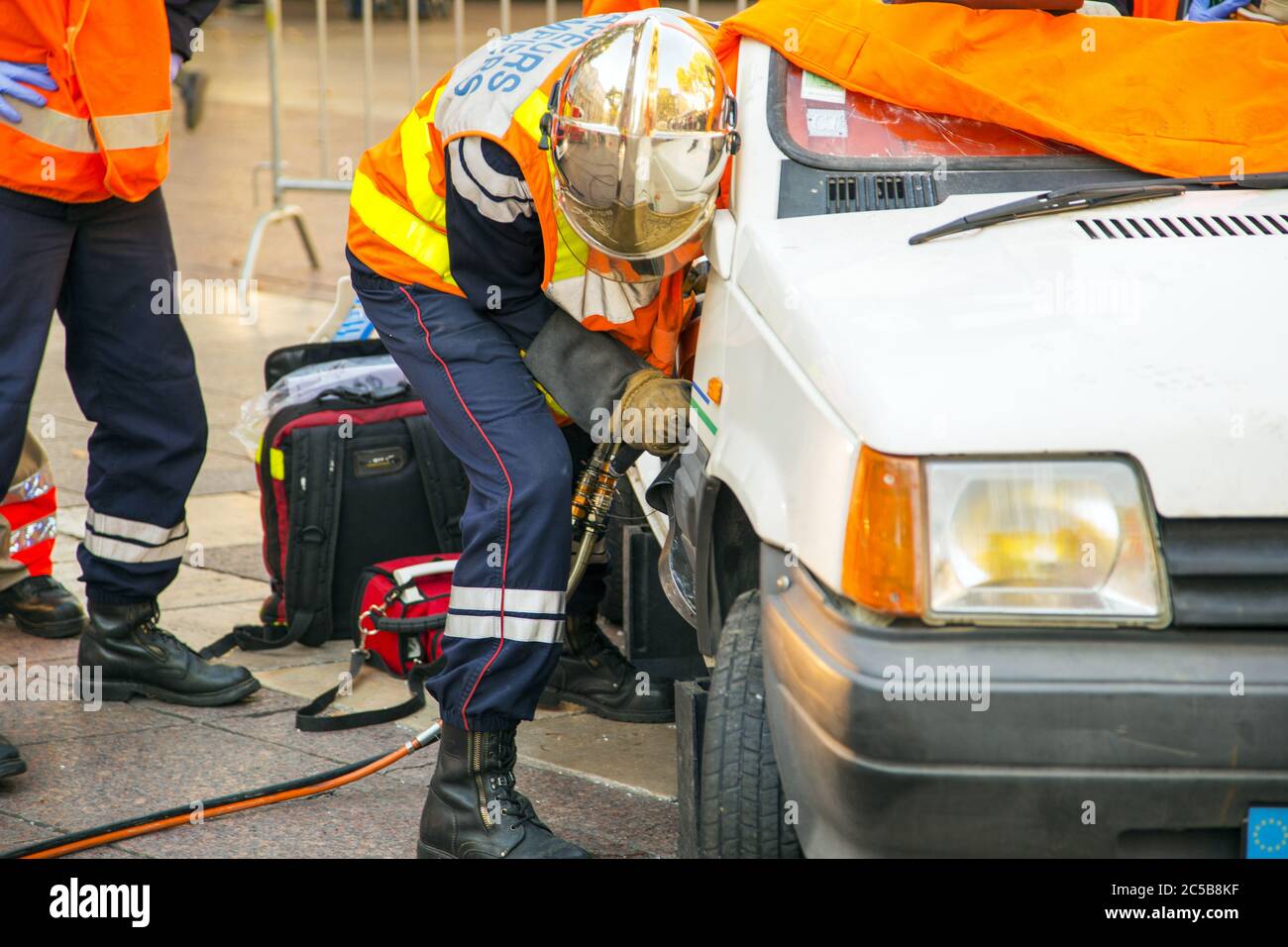 Rescue Team working after car accident Stock Photo - Alamy