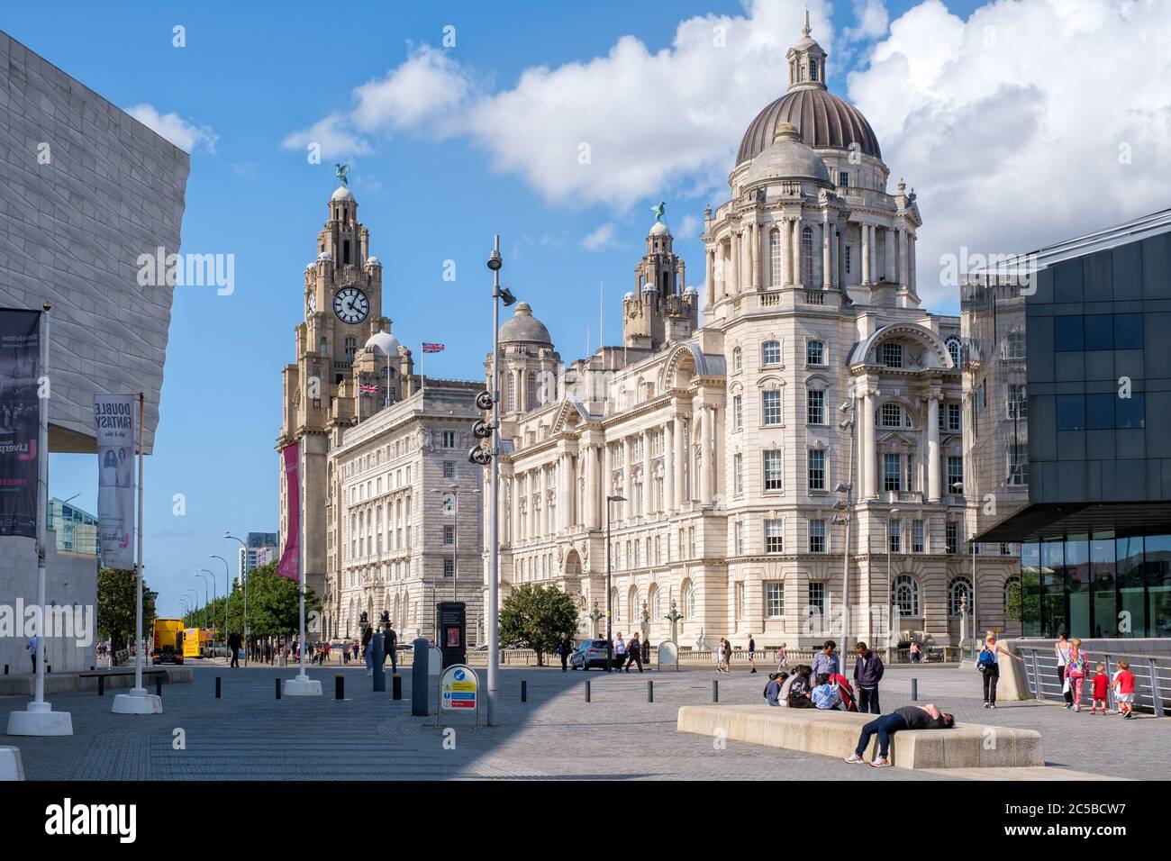 Street scene in Liverpool with a view of the historic Three Graces ...