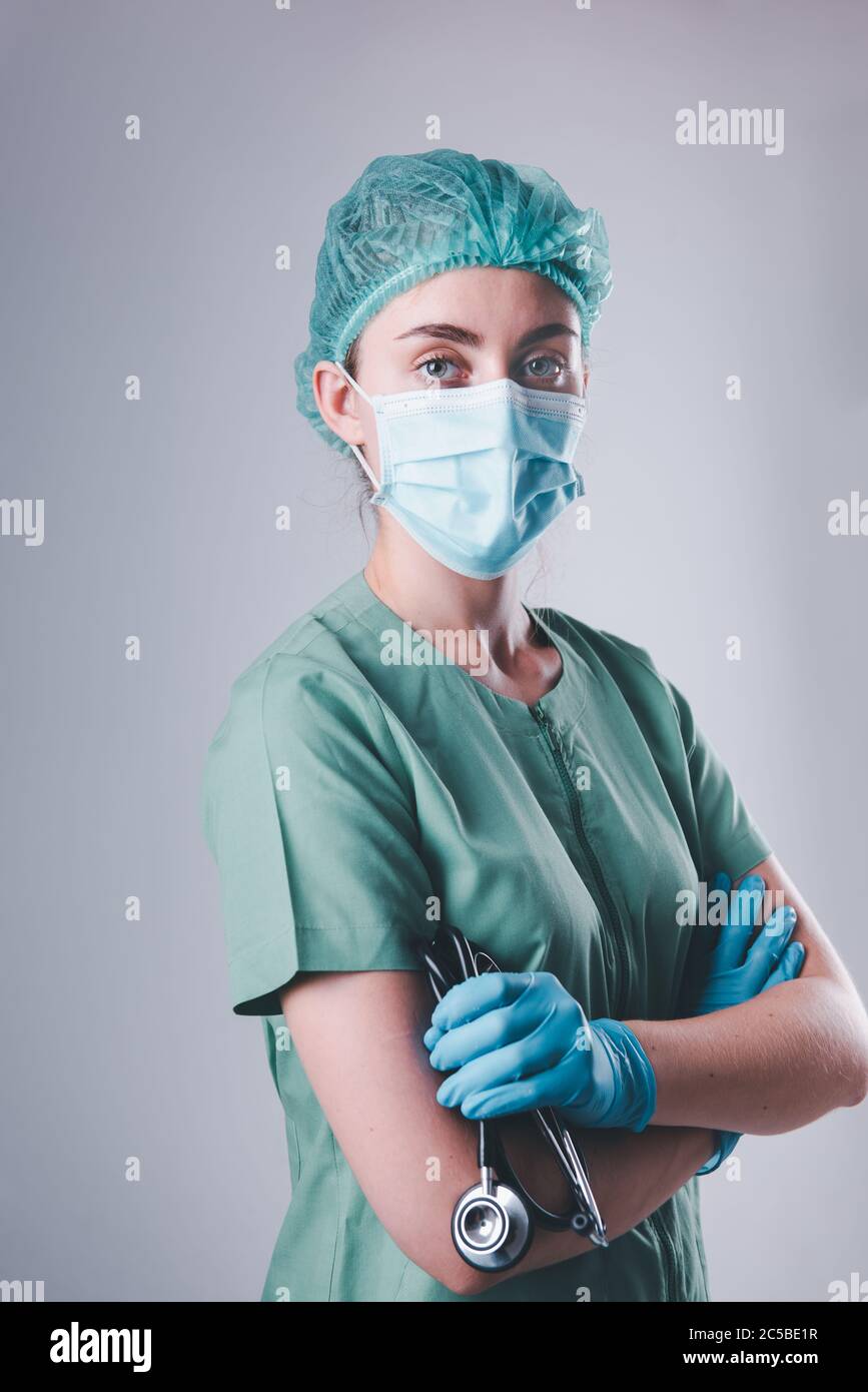 Female Doctor in Protective Mask and Medical Cap on Isolated Background ...