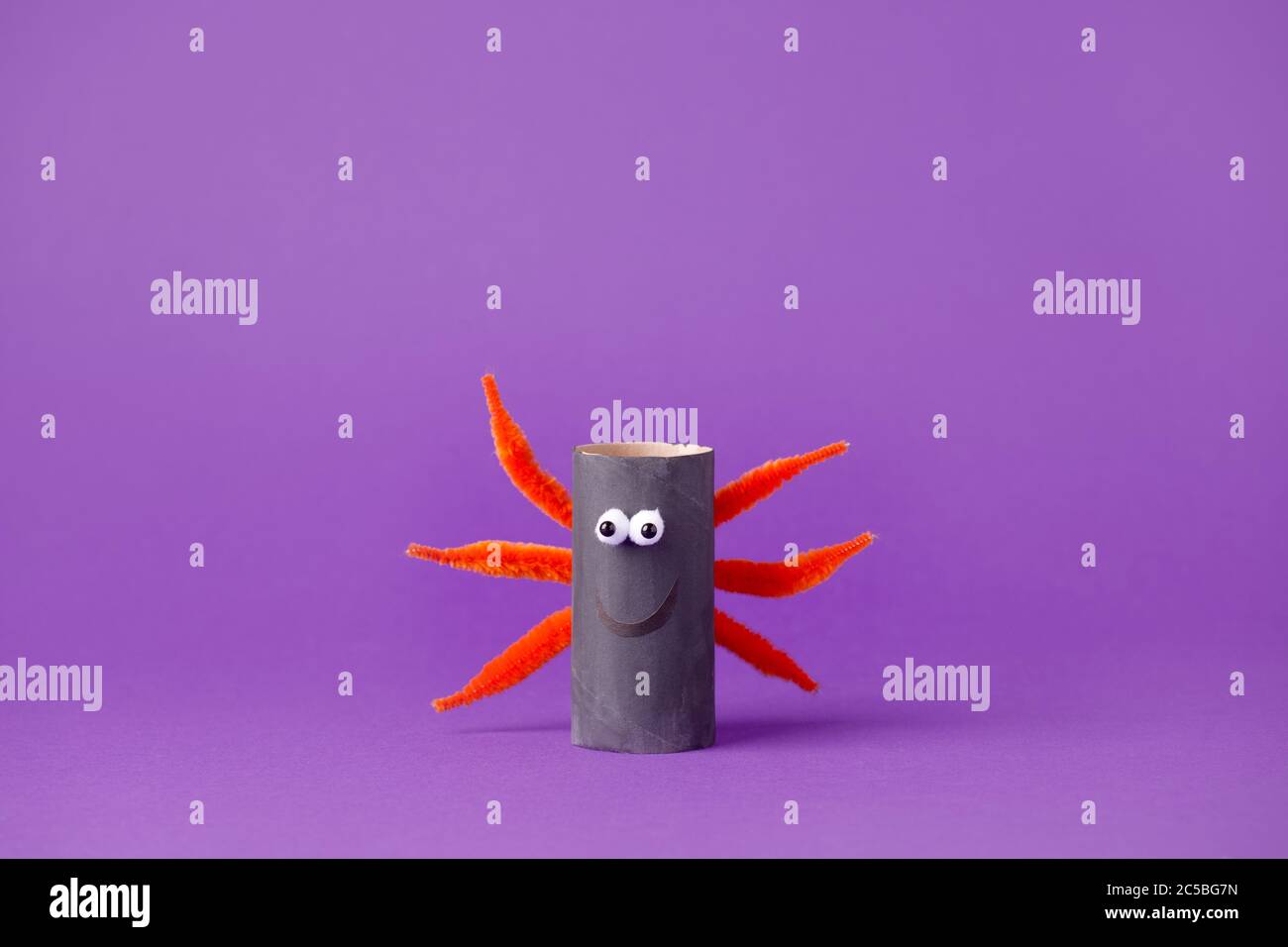 Halloween toy collection of spiders on purple for Halloween concept ...