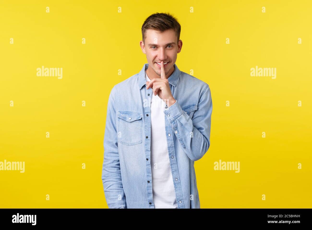 Man keeping secret asking silence hi-res stock photography and images ...