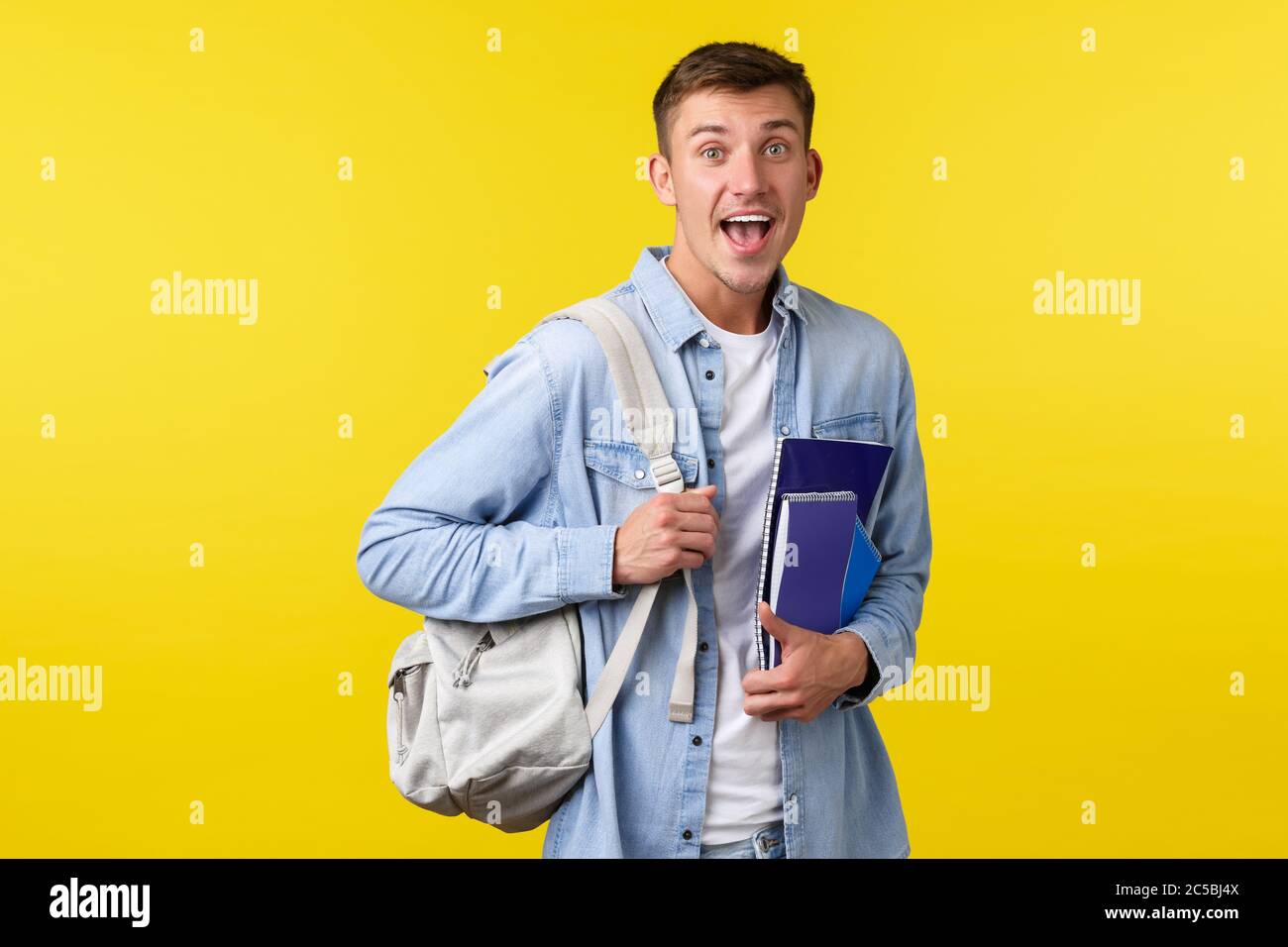 Education, courses and university concept. Surprised happy smiling guy ...