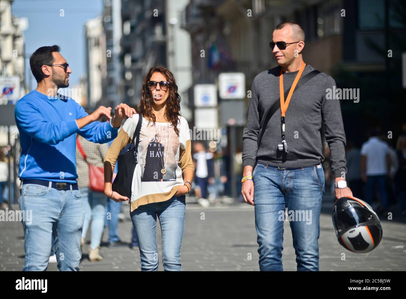 Italian friends walking and talking in Via Sparano da Bari. Bari, Italy ...