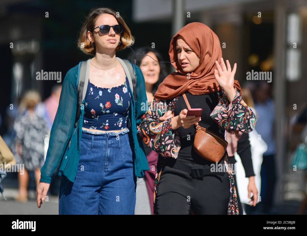 Muslim girl walking hi-res stock photography and images - Alamy