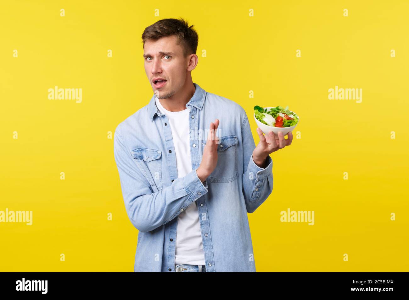Healthy lifestyle, people and food concept. Alarmed and bothered ...
