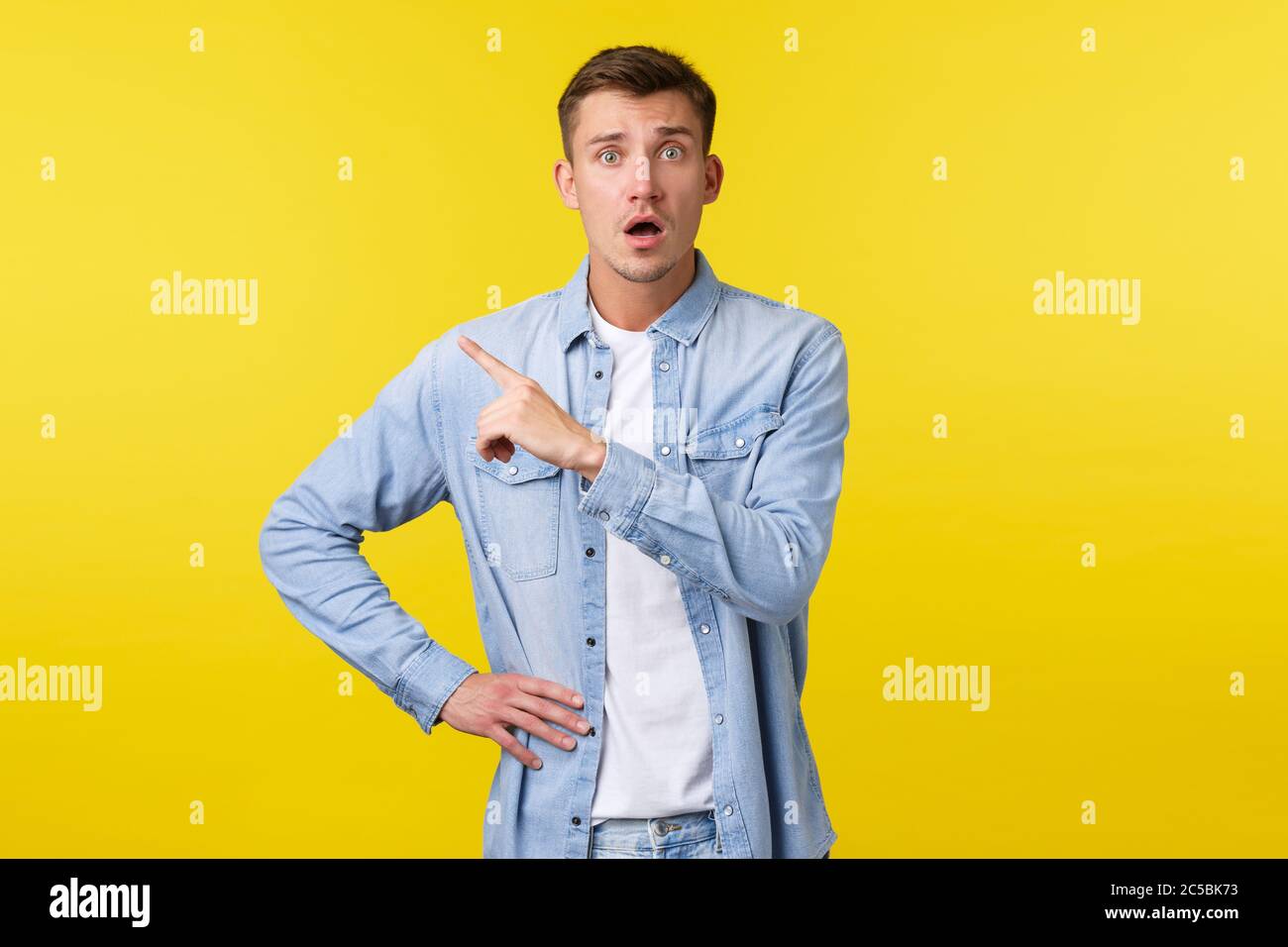 Worried and concerned blond handsome guy looking insecure and anxious ...