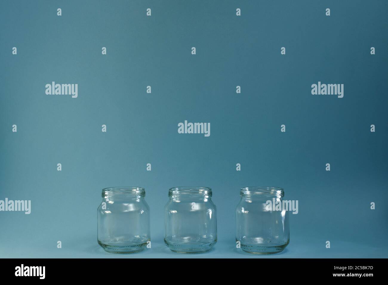 Three glass jars at the bottom of the center horizontal row Stock Photo ...