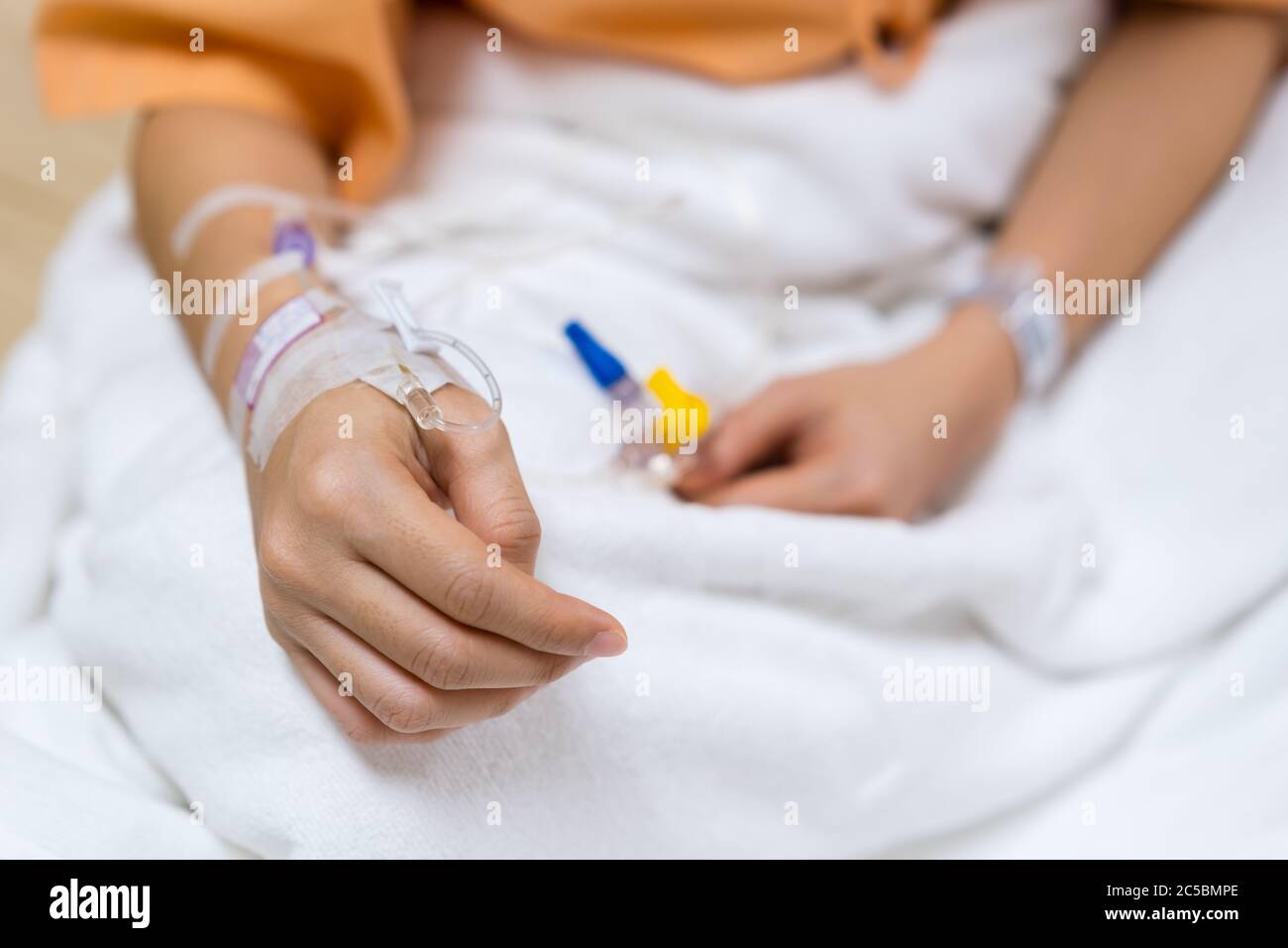 patient hand in the hospital with a saline Stock Photo - Alamy