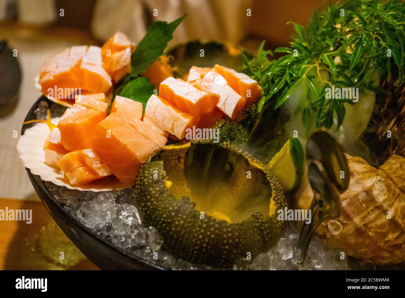 Vietnamese - Asian people eating sashimi set in Japanese restaurant ...