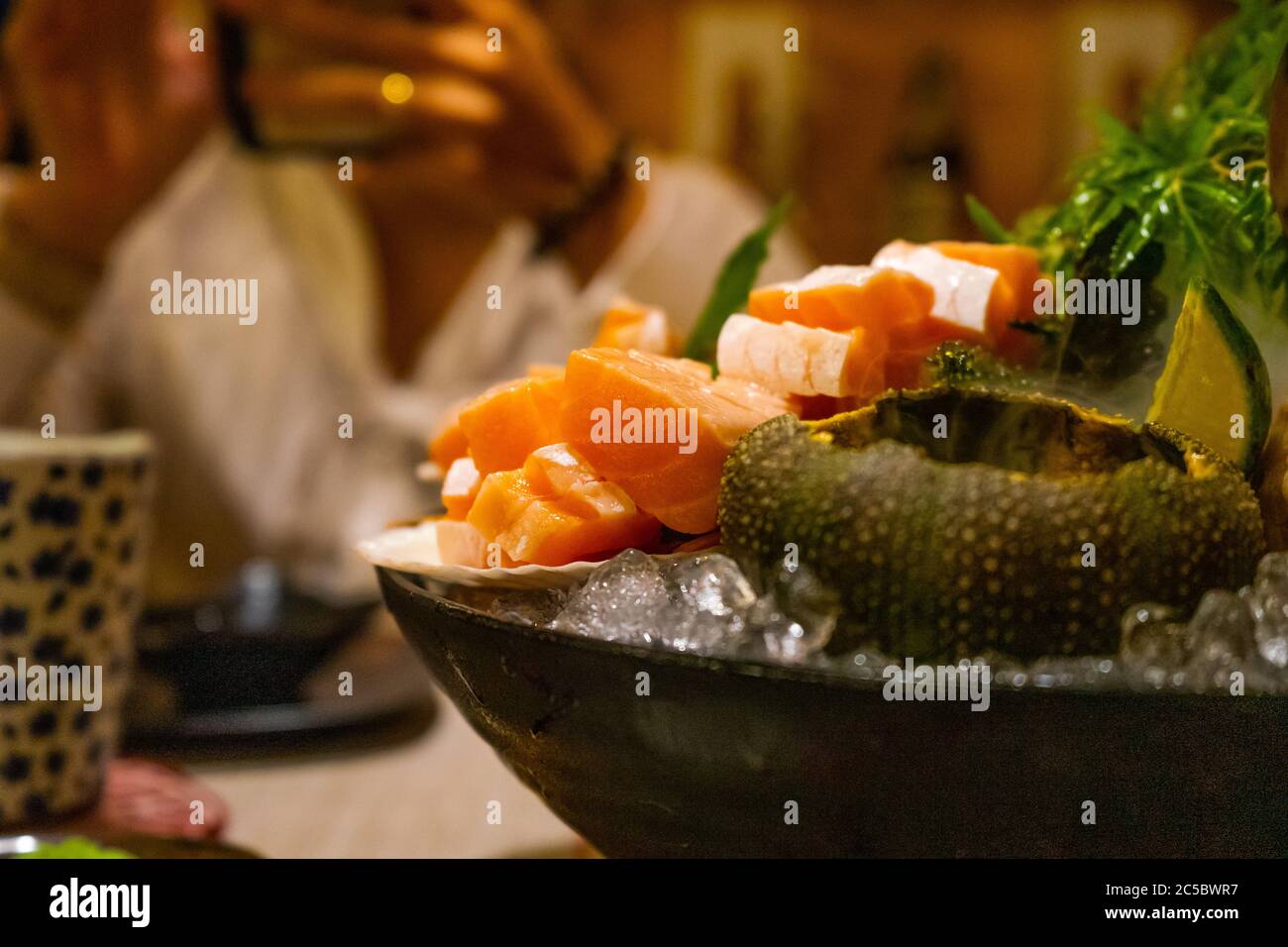 Vietnamese - Asian people eating sashimi set in Japanese restaurant ...