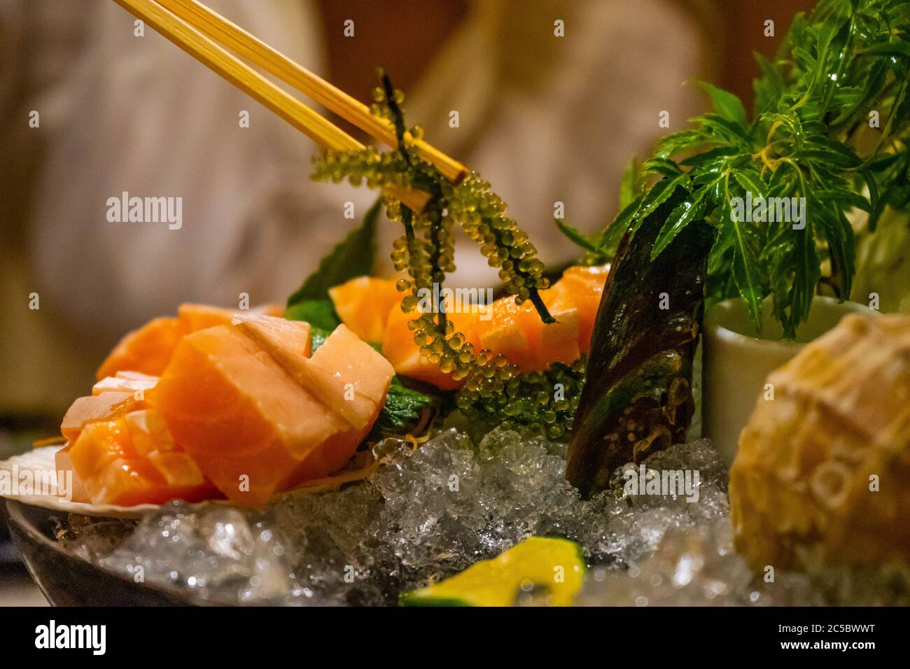 Vietnamese - Asian people eating sashimi set in Japanese restaurant ...