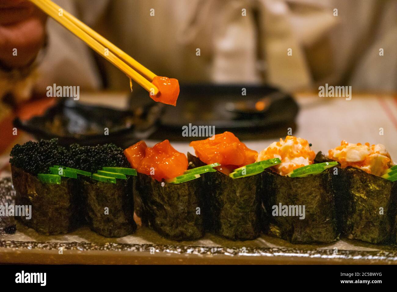Vietnamese - Asian people eating sashimi set in Japanese restaurant ...