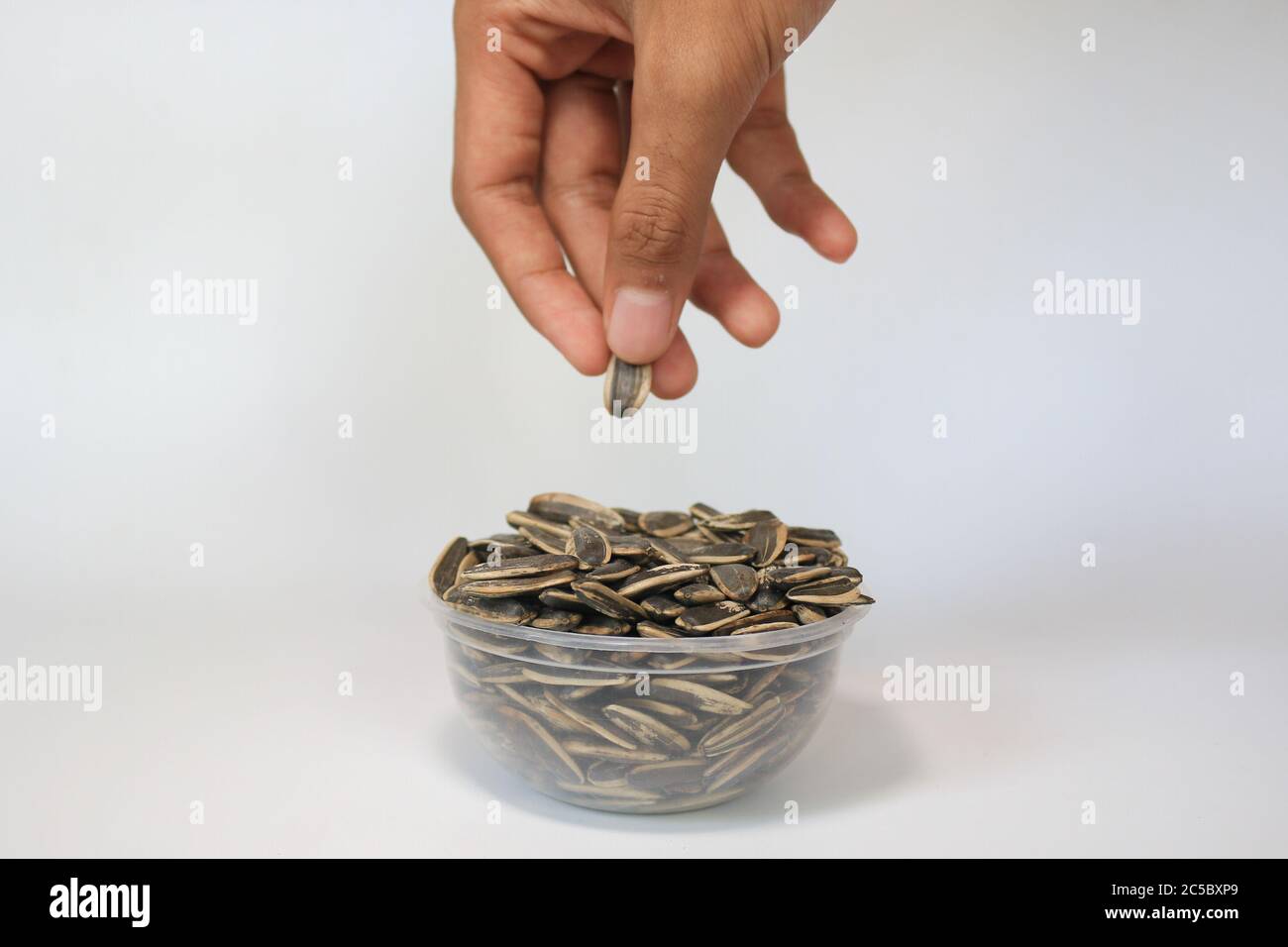 Closeup hand pick sunflower hi-res stock photography and images - Alamy