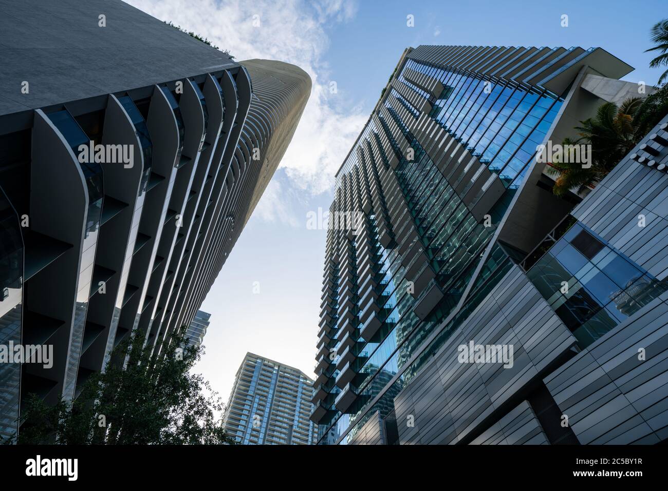 Highrise skyscrapers show from ground angle facing up Stock Photo - Alamy