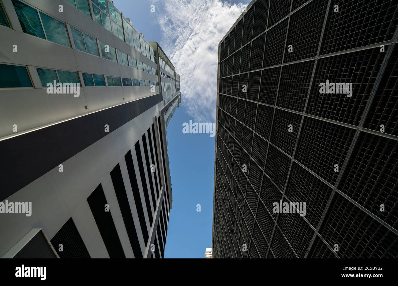 Narrow space between two tall buildings in the city Stock Photo - Alamy