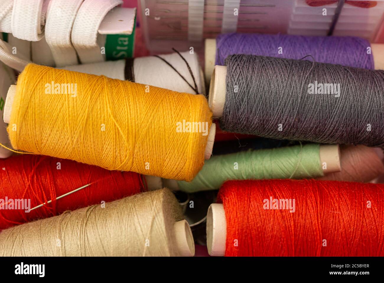 Collection of various colored tread used to sew clothes Stock Photo - Alamy