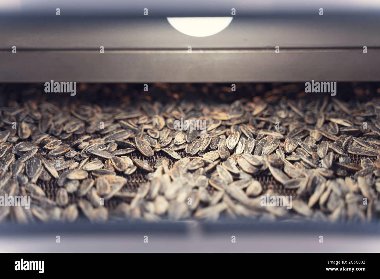 roasted sunflowers in sunflower roasting machine Stock Photo - Alamy
