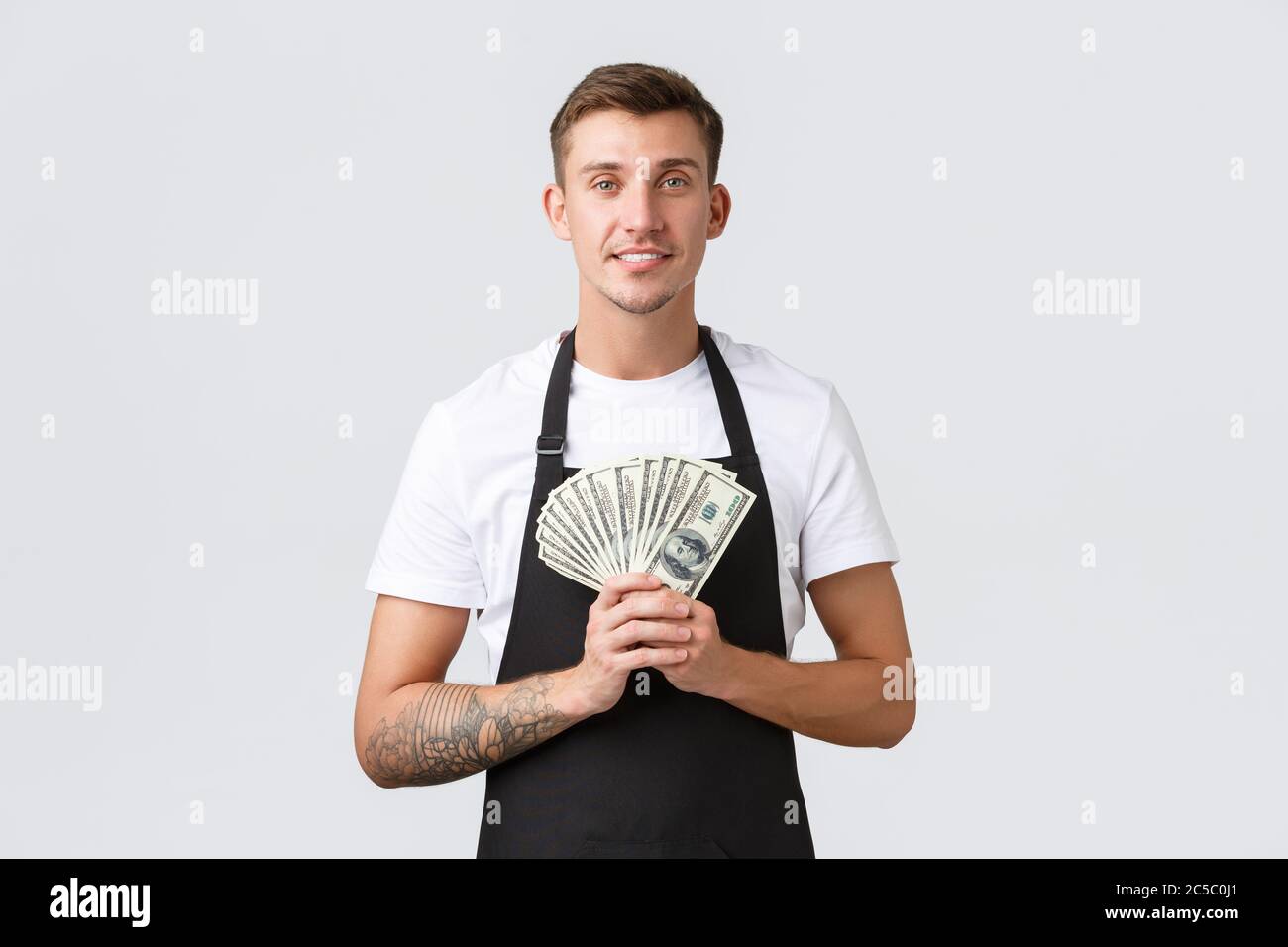 Small retail business, payments and employees concept. Smiling good ...