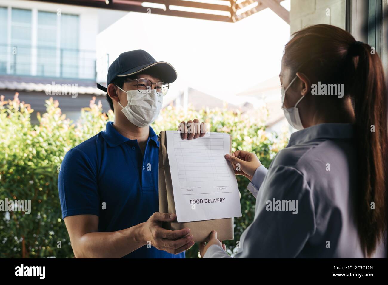 Handing A Bag High Resolution Stock Photography and Images - Alamy