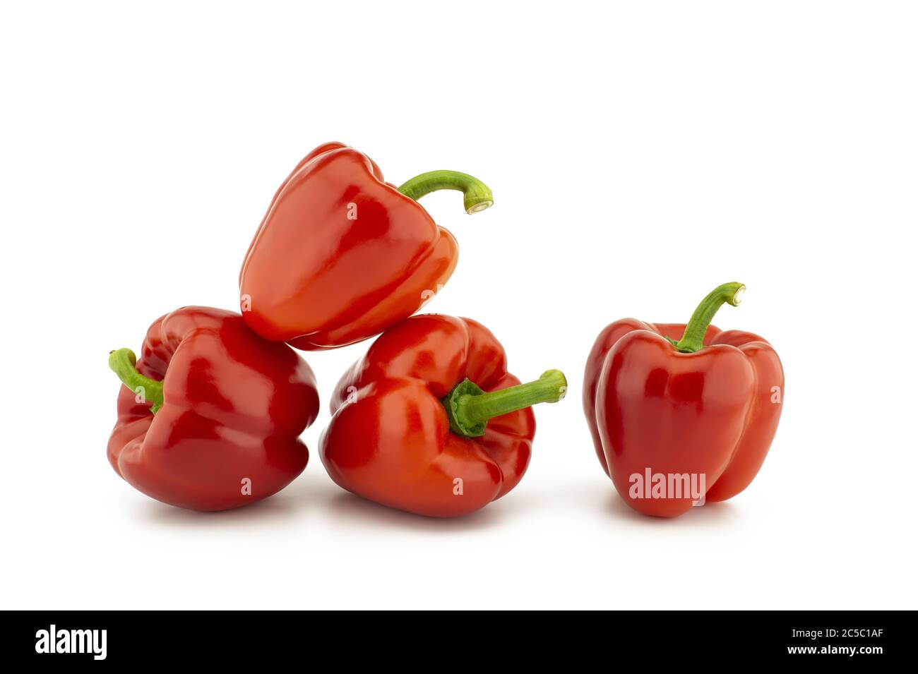 A stack of red bell peppers isolated on white background Stock Photo ...