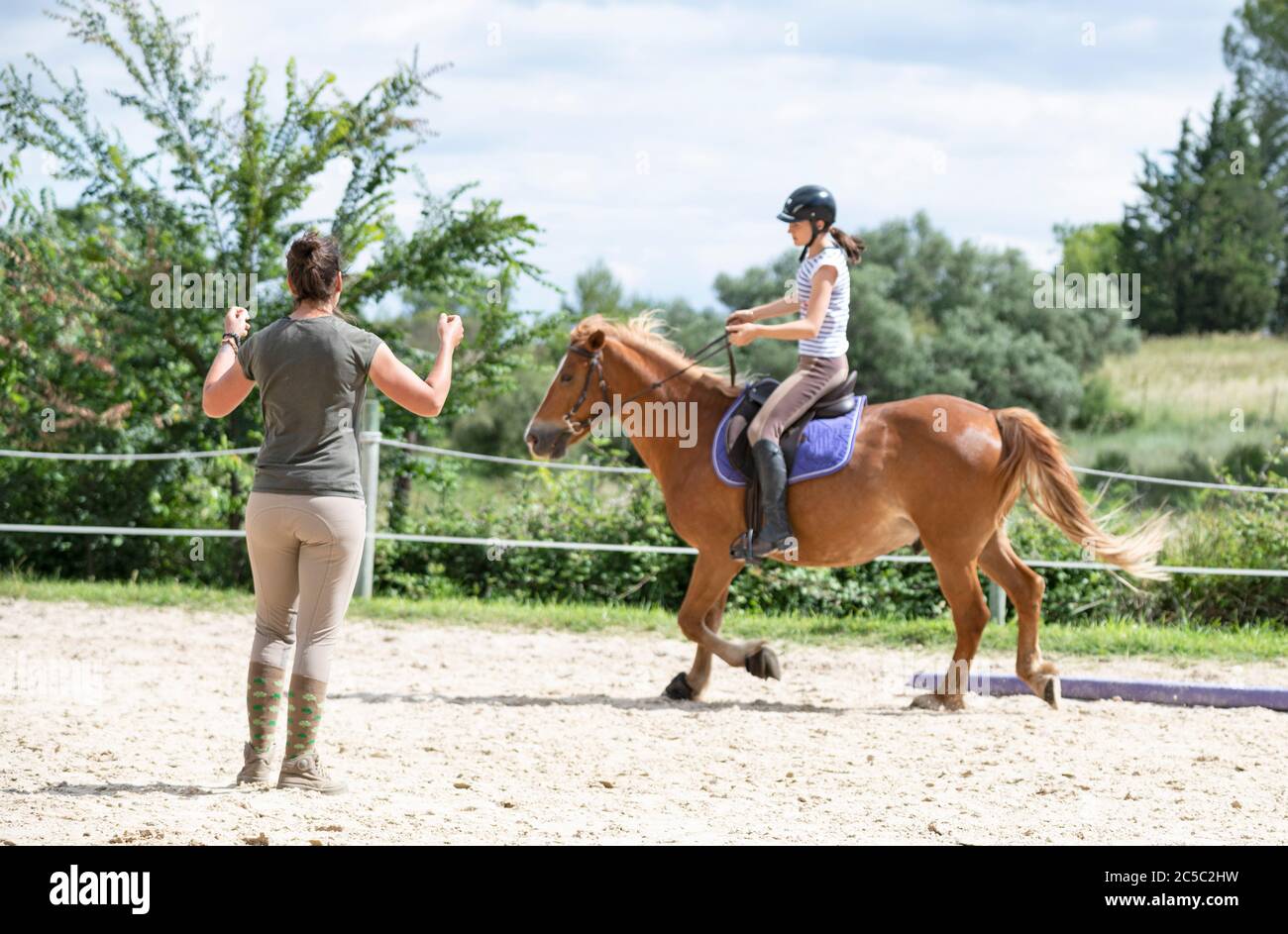 riding girl are training her horse in equestrian center Stock Photo - Alamy