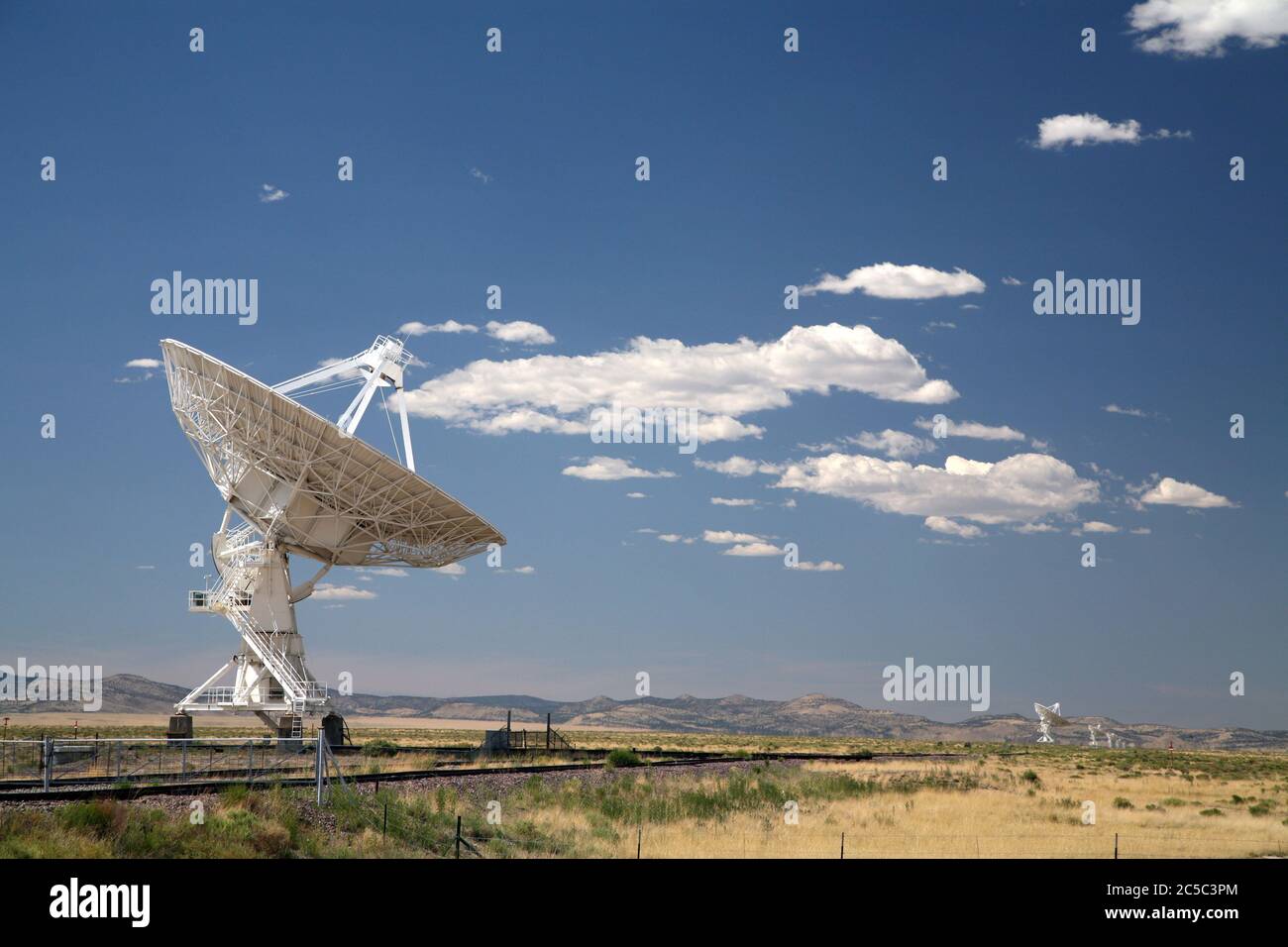 View of a single radio astronomy dish on tracks at the Very Large Array ...
