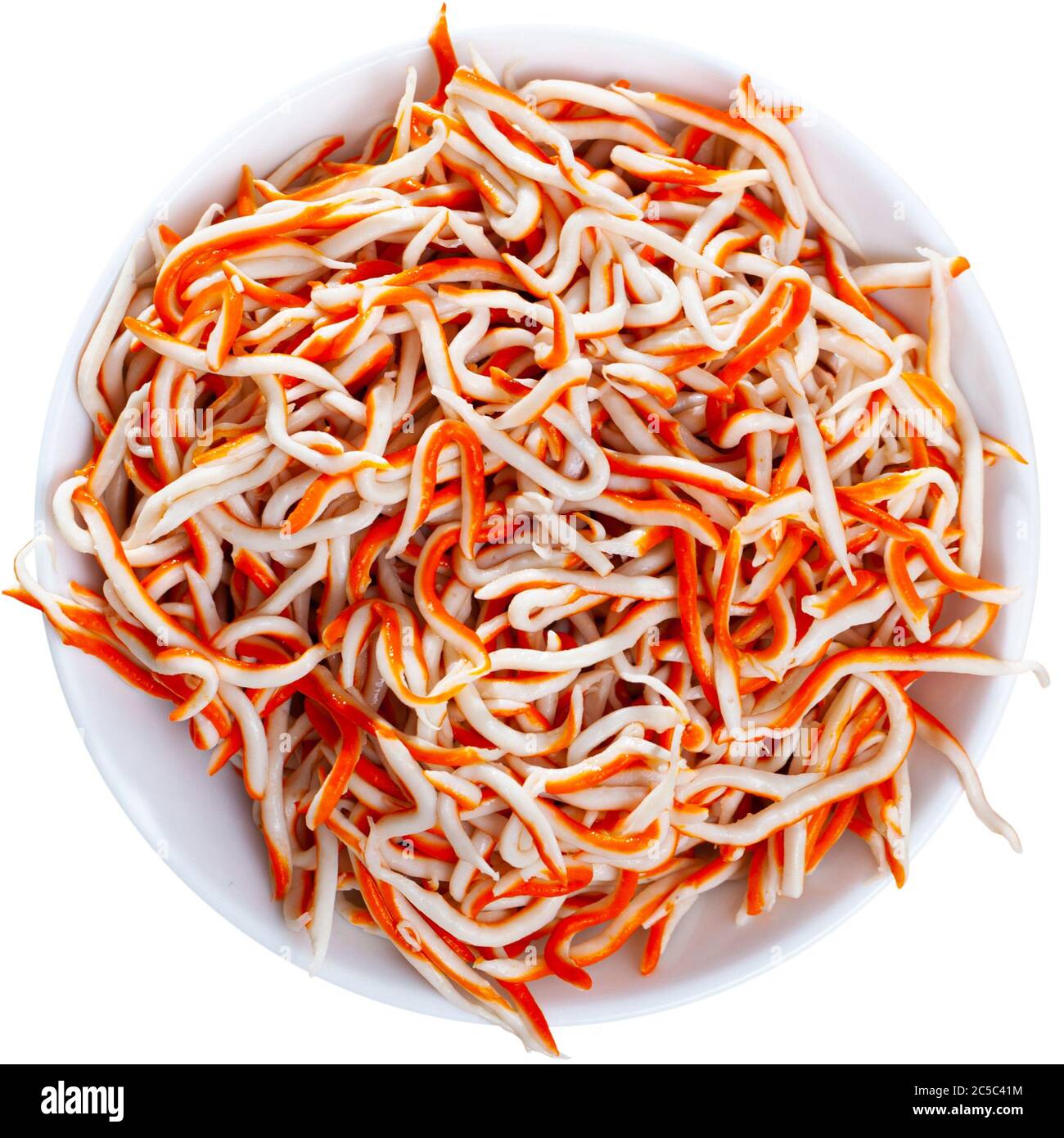 Bowl with tasty grated surimi appetizer. Isolated over white background ...