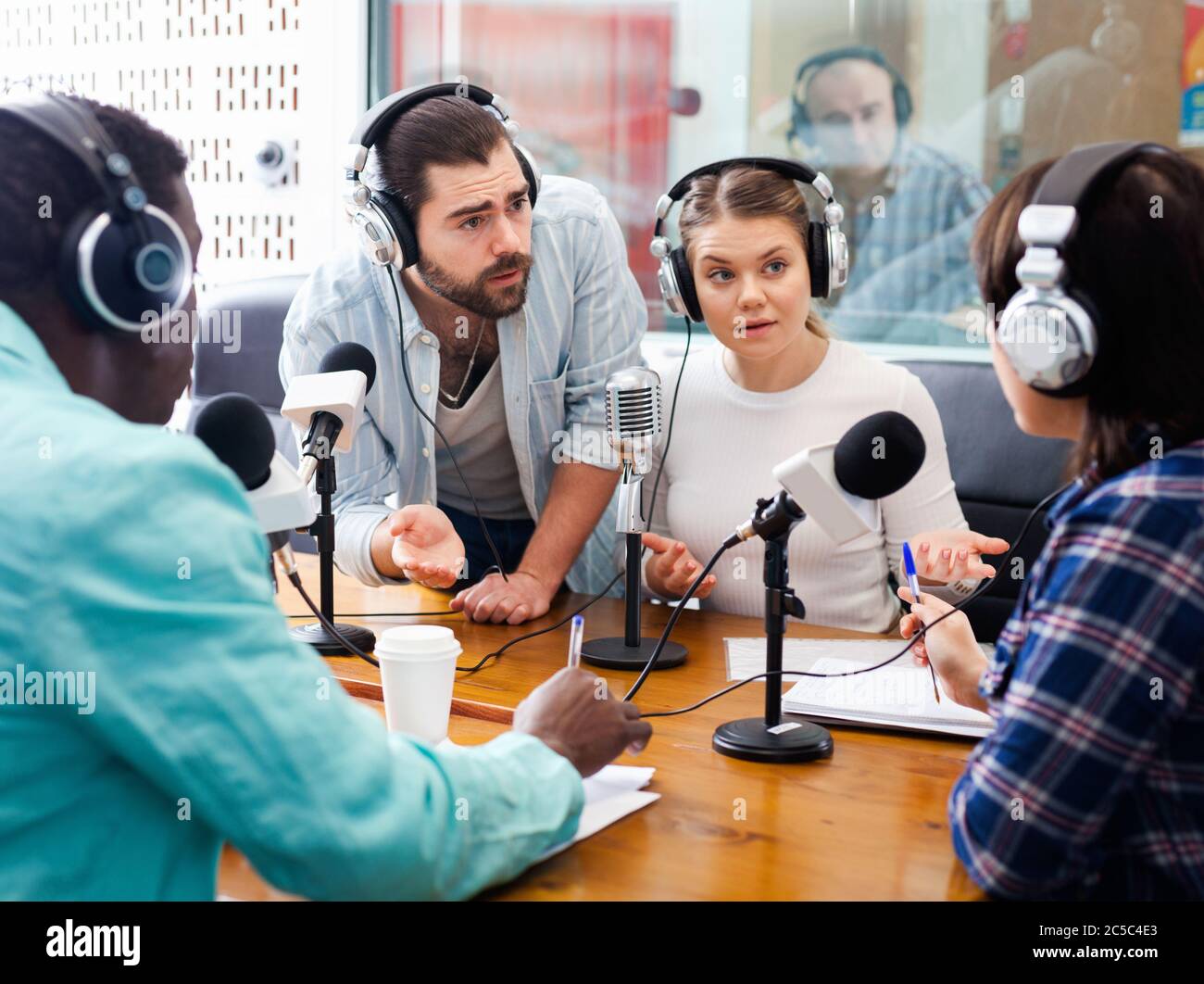 Scandal interview. Two young outraged guests answering provocative ...