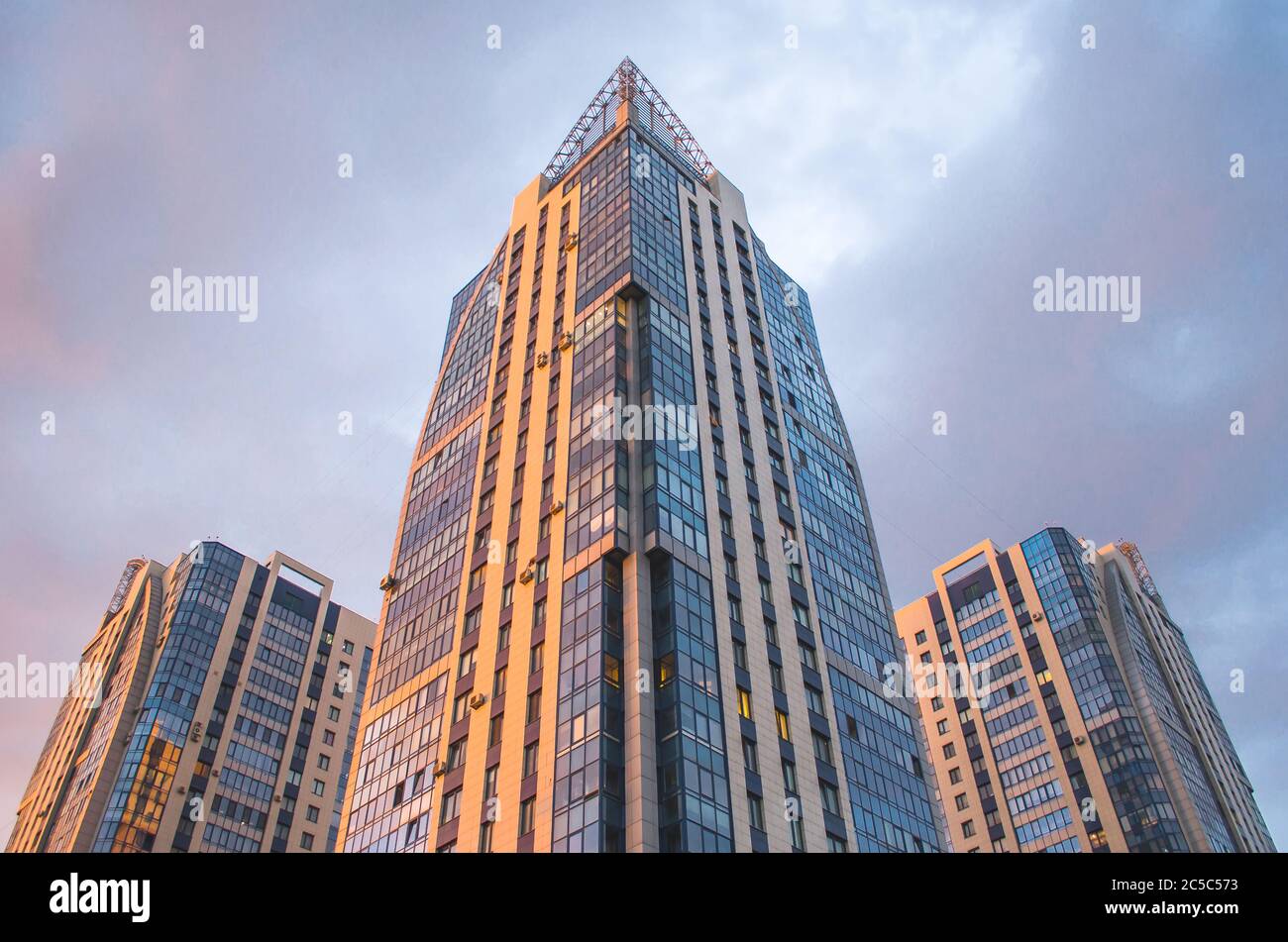 Three high residential in buildings at sunset Stock Photo - Alamy