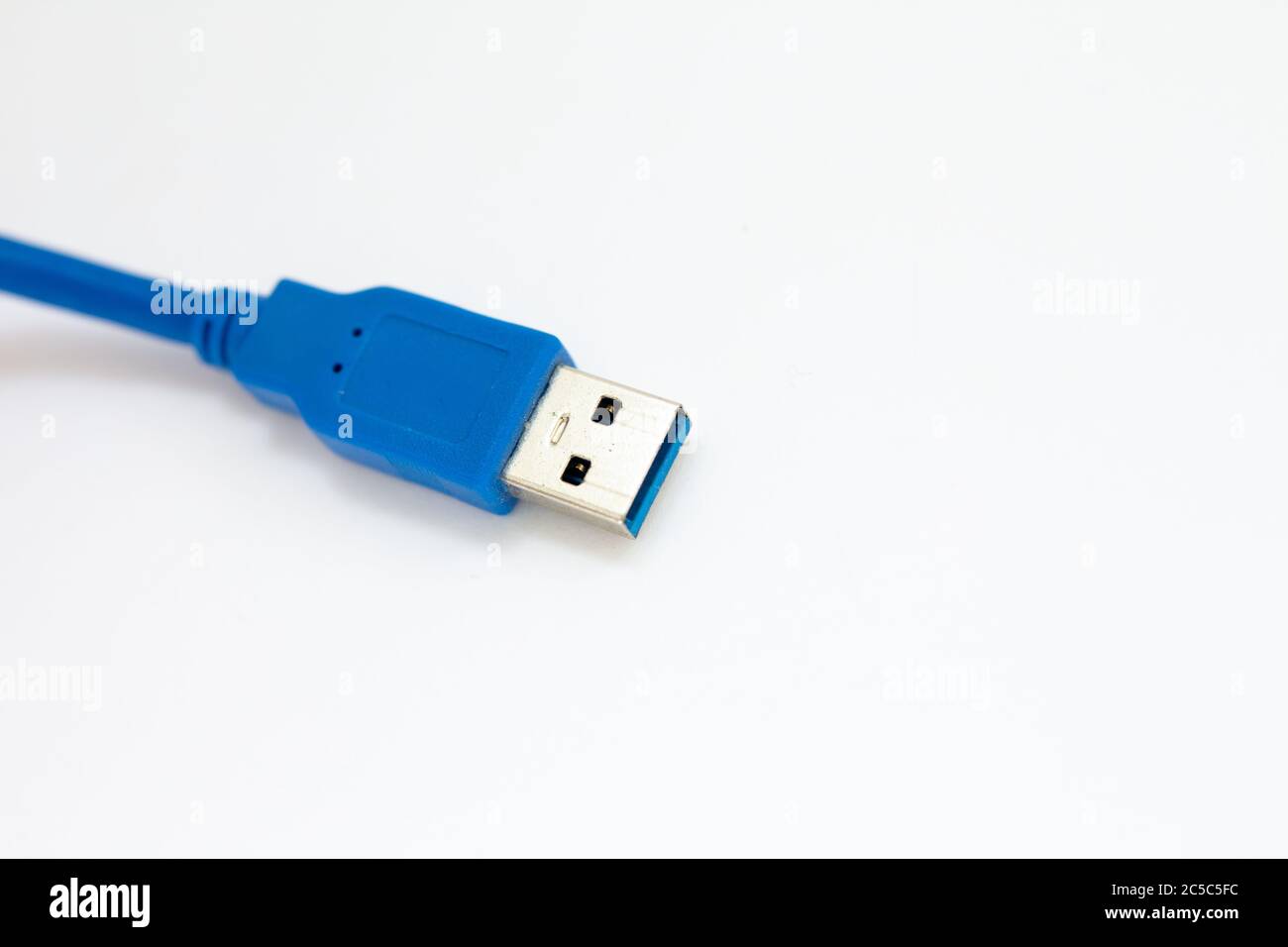 blue usb cable on white background Stock Photo - Alamy