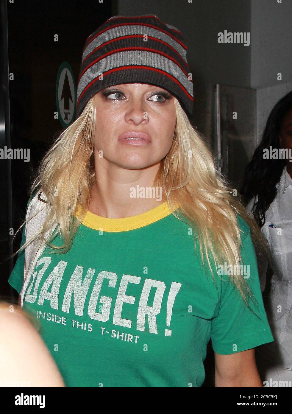 MIAMI - DECEMBER 06: Pamela Anderson arrives at Miami International ...