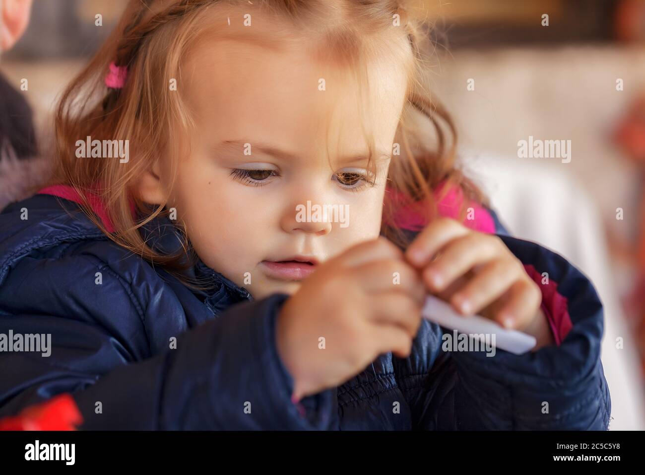 child at play in the yard, note shallow depth of field Stock Photo - Alamy