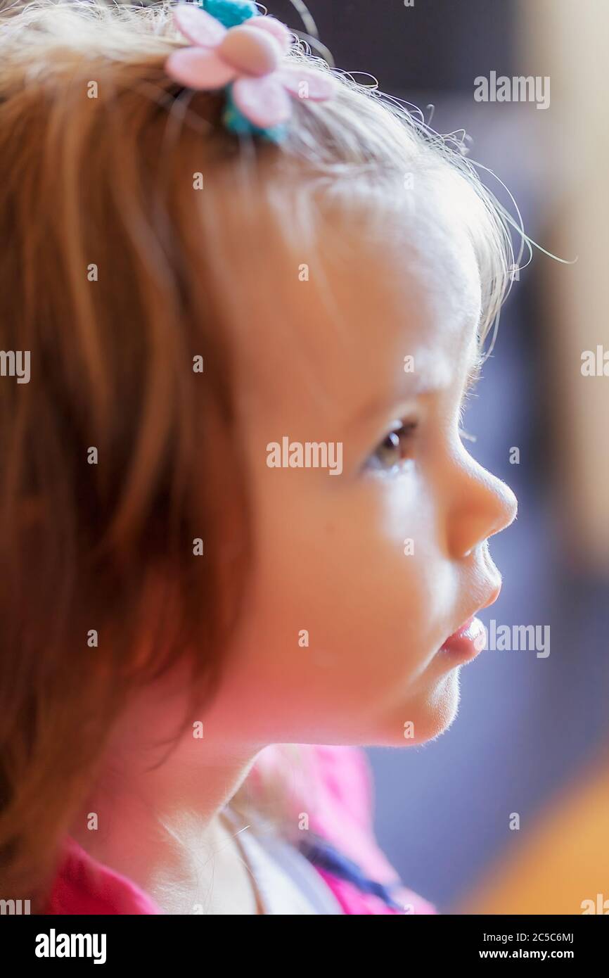 image of a child from profile while watched tv, note shallow depth of ...