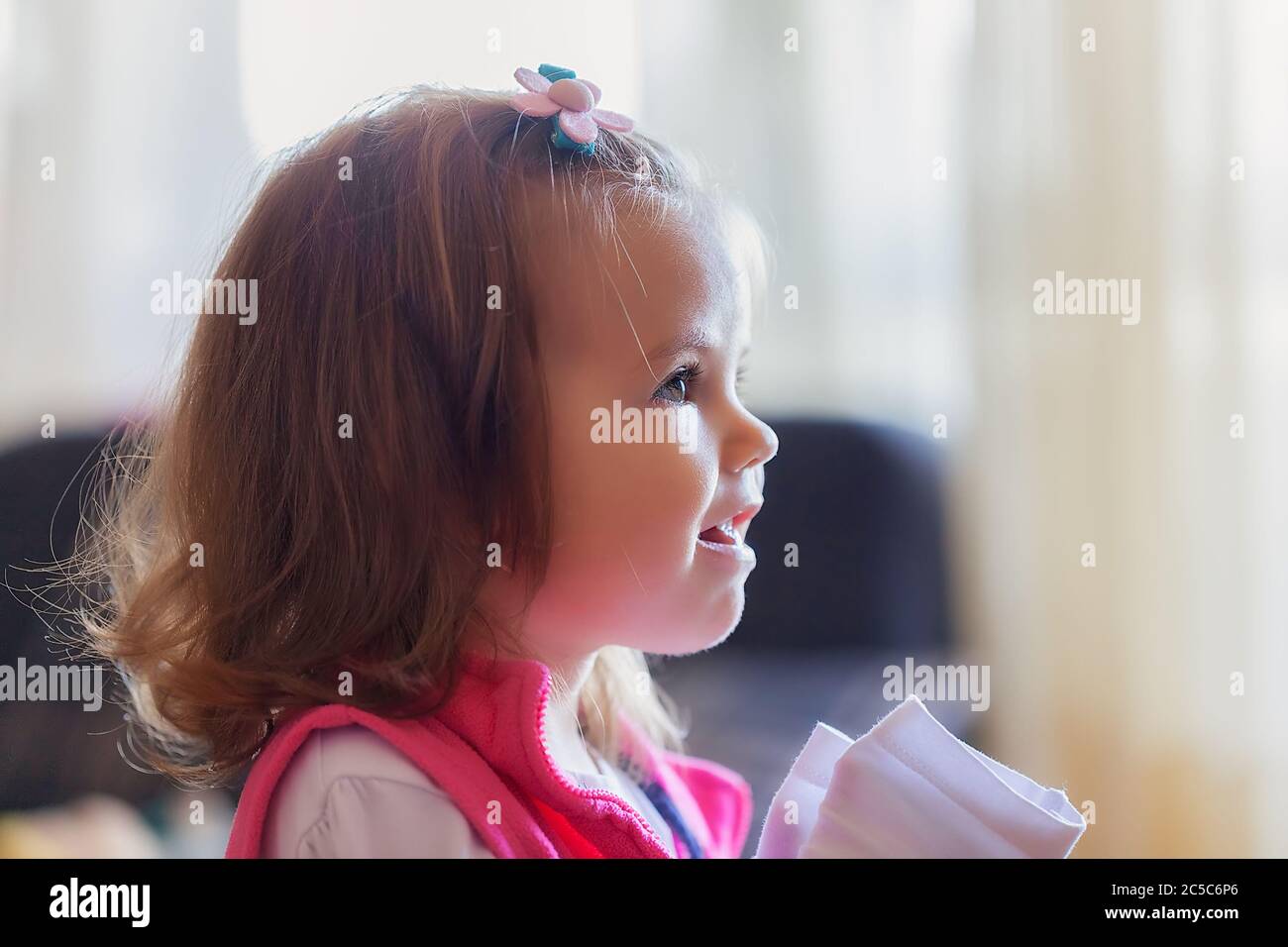 image of a child from profile while watched tv, note shallow depth of ...