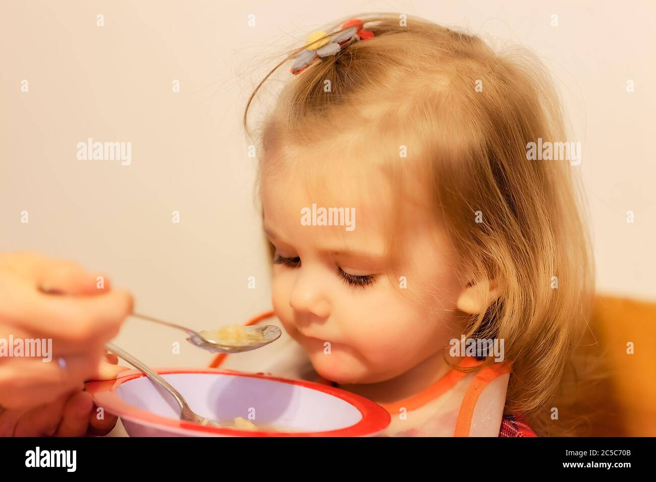 a child has breakfast, note shallow depth of field Stock Photo - Alamy