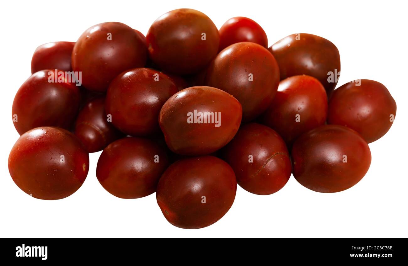 Pile of mini tomatoes of exotic selection variety of Kumato. Isolated ...