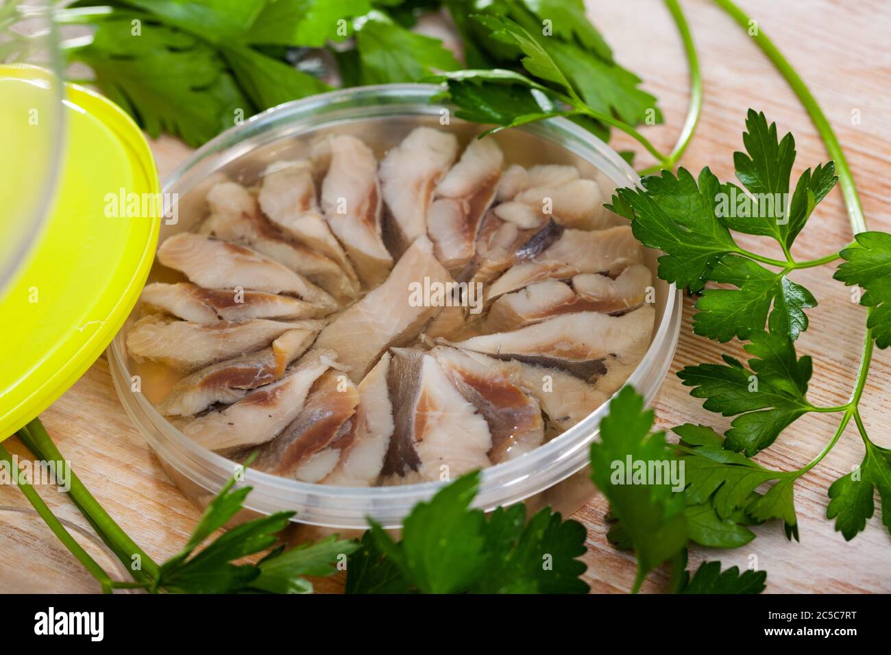 Preserved sardines marinated in oil in plastic container Stock Photo ...