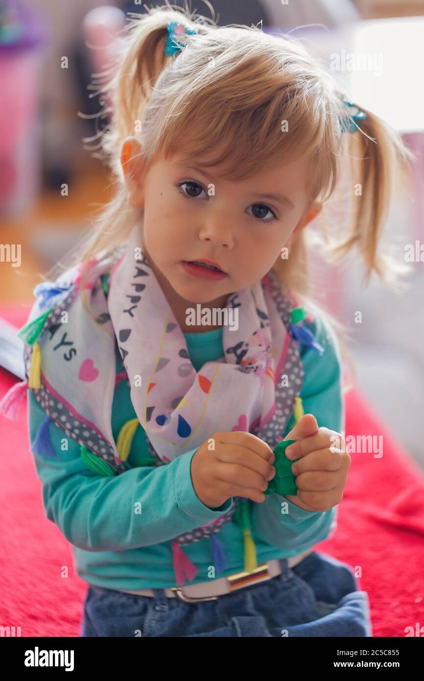 little girl with a scarf around his neck Stock Photo - Alamy