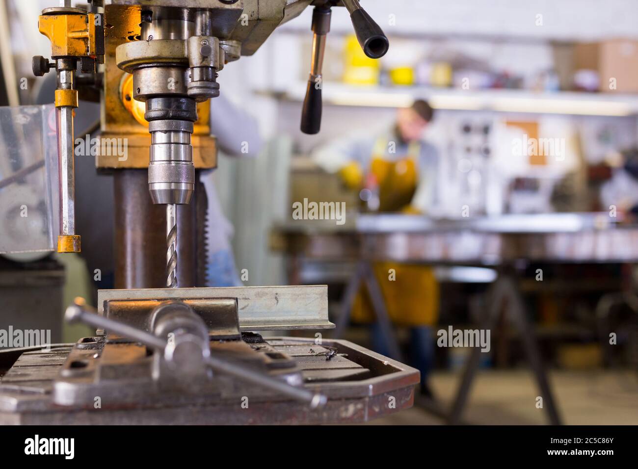 Drilling machine in factory workshop Stock Photo - Alamy