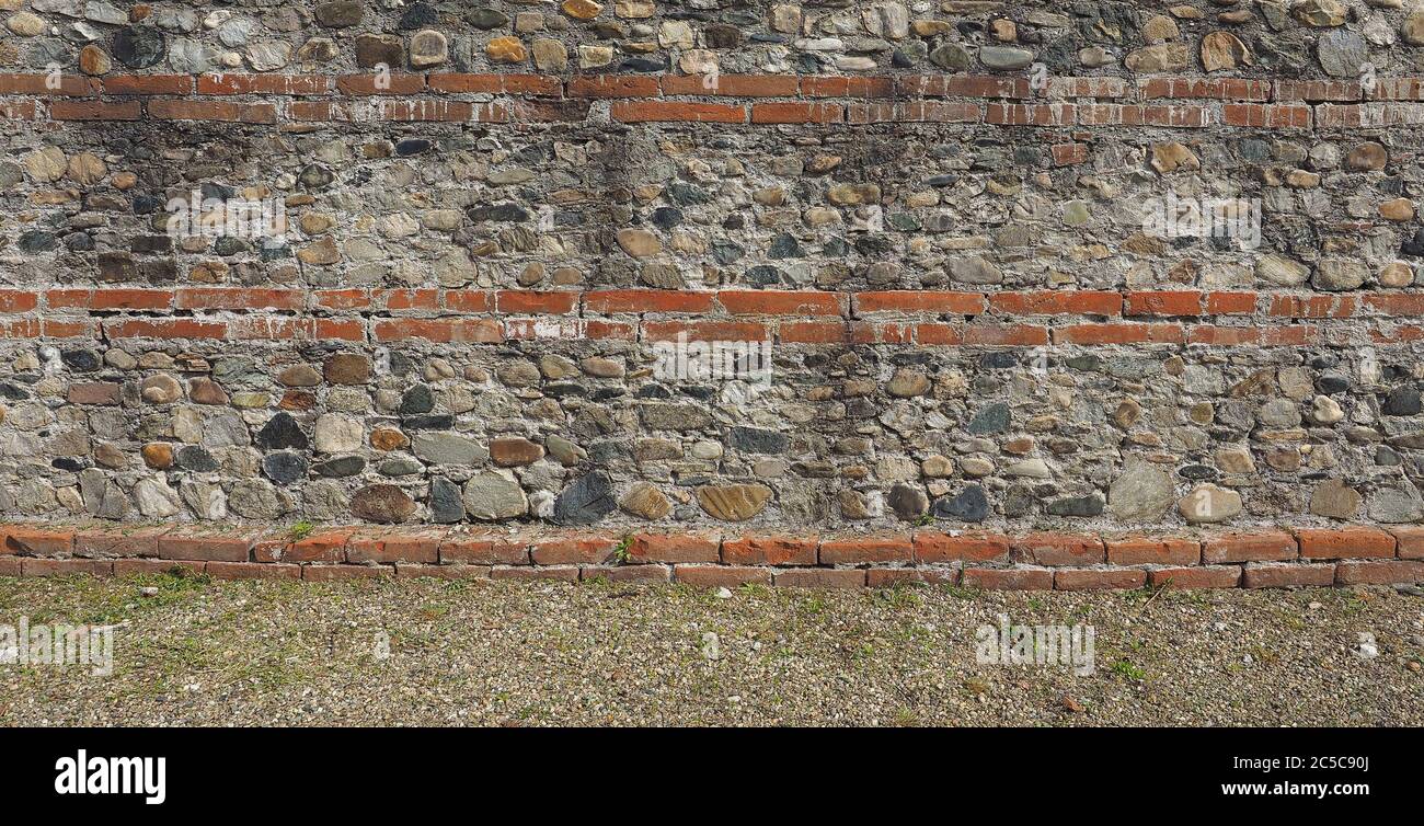 old red bricks and stones wall useful as a background Stock Photo - Alamy