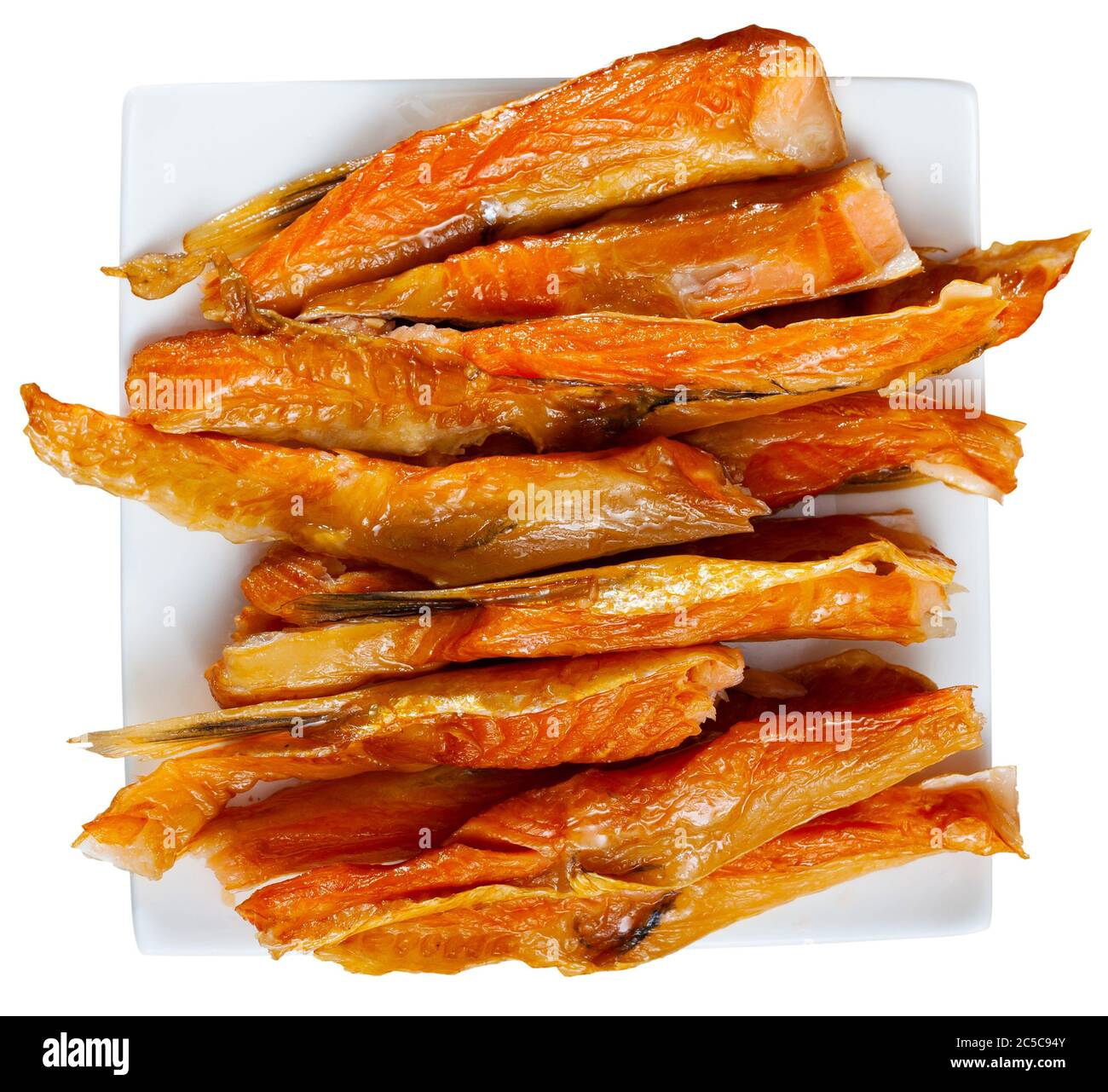 Strips of cold-smoked red fish on plate. Isolated over white background ...